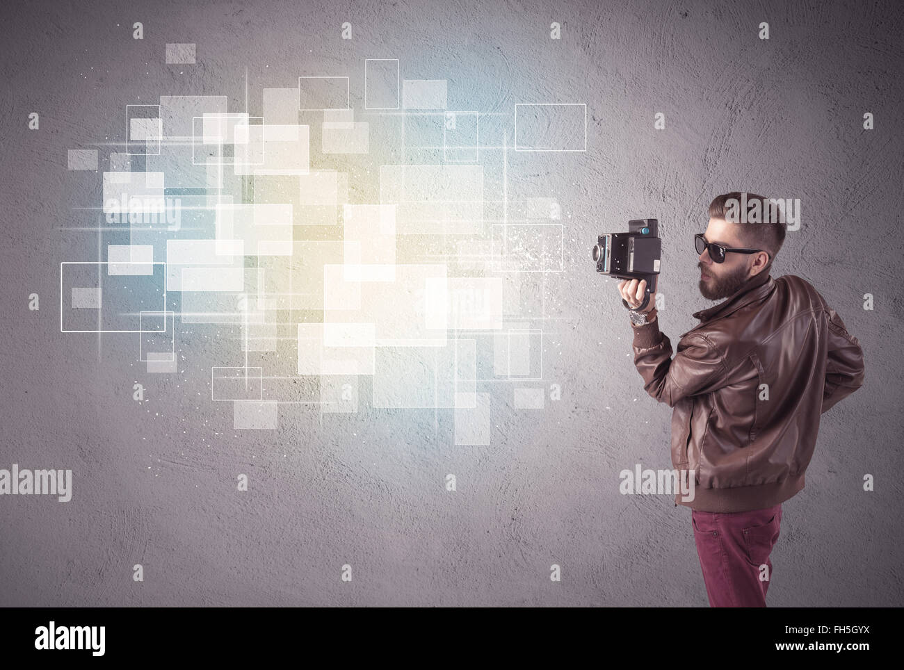 Hipster guy with retro camera in action Stock Photo - Alamy