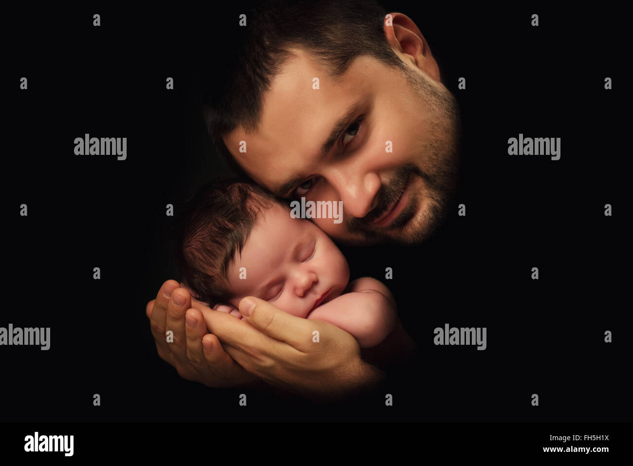 Daddy hugs his newborn baby. Father 's love. Close-up portrait on a ...