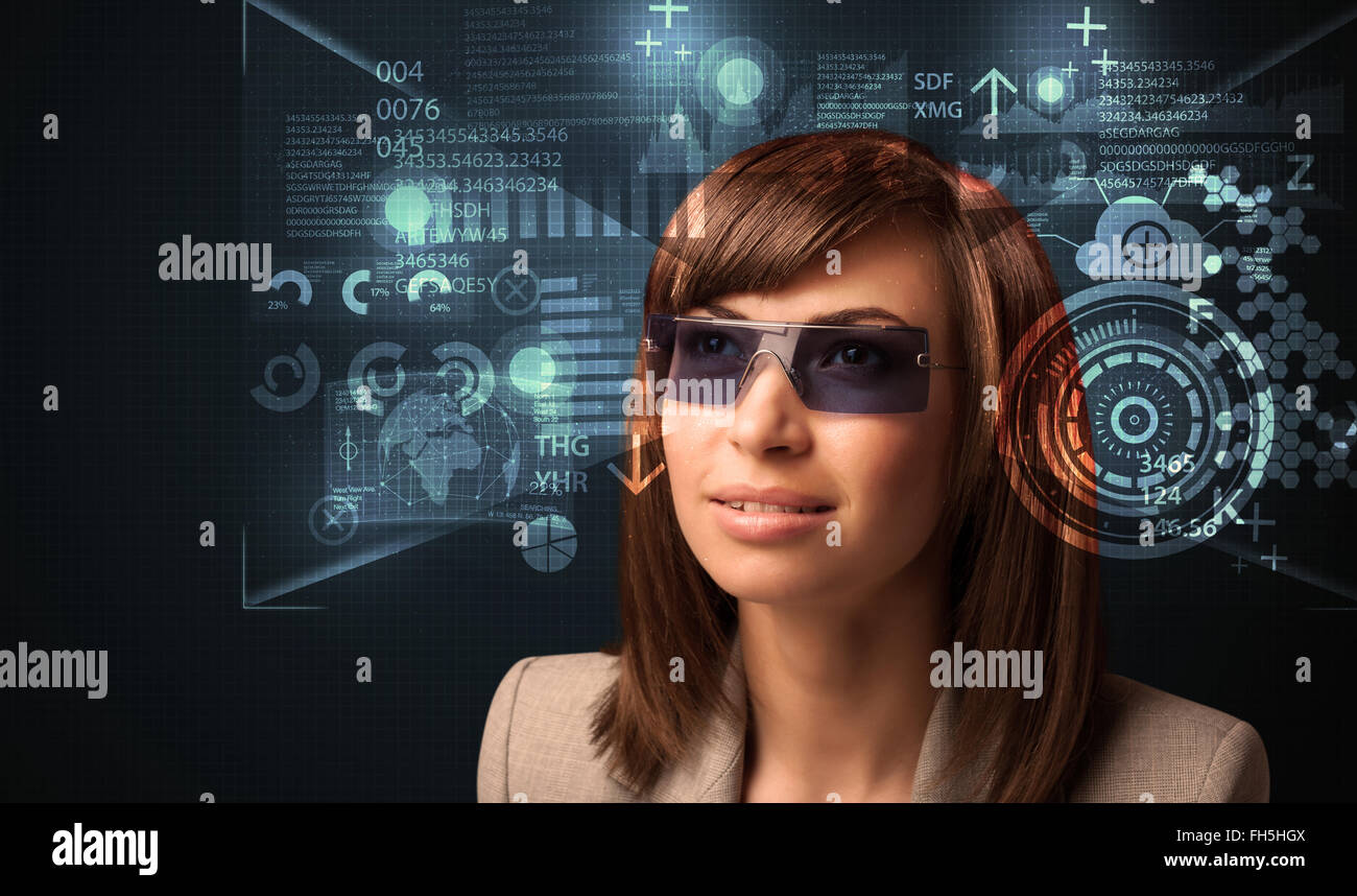 Young woman looking with futuristic smart high tech glasses Stock Photo ...
