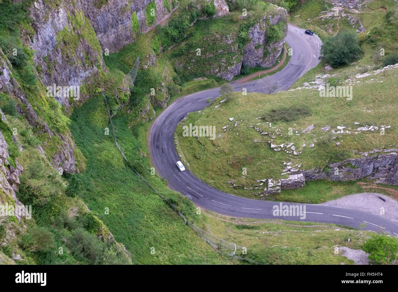 Aerial view of Cheddar gorge with cars, a curve known as Horseshoe bend ...
