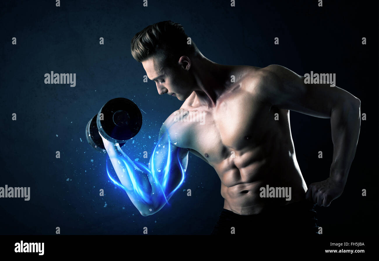 Fit athlete lifting weight with blue muscle light concept Stock Photo ...