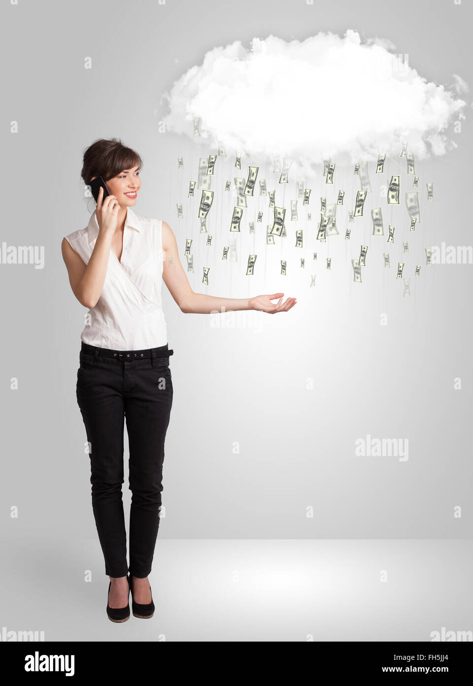 Woman with cloud and money rain concept Stock Photo - Alamy