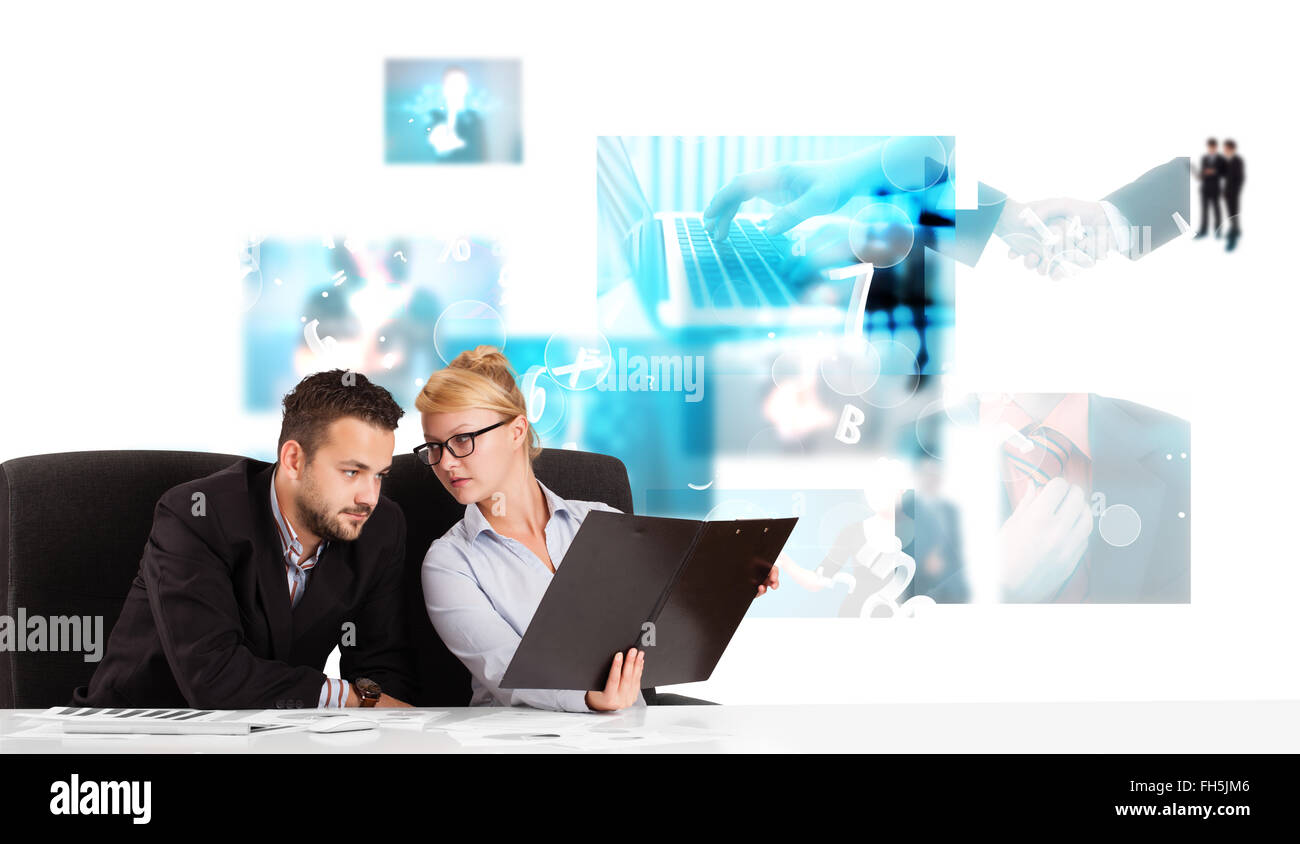 Business persons at desk with modern tech images at background Stock ...