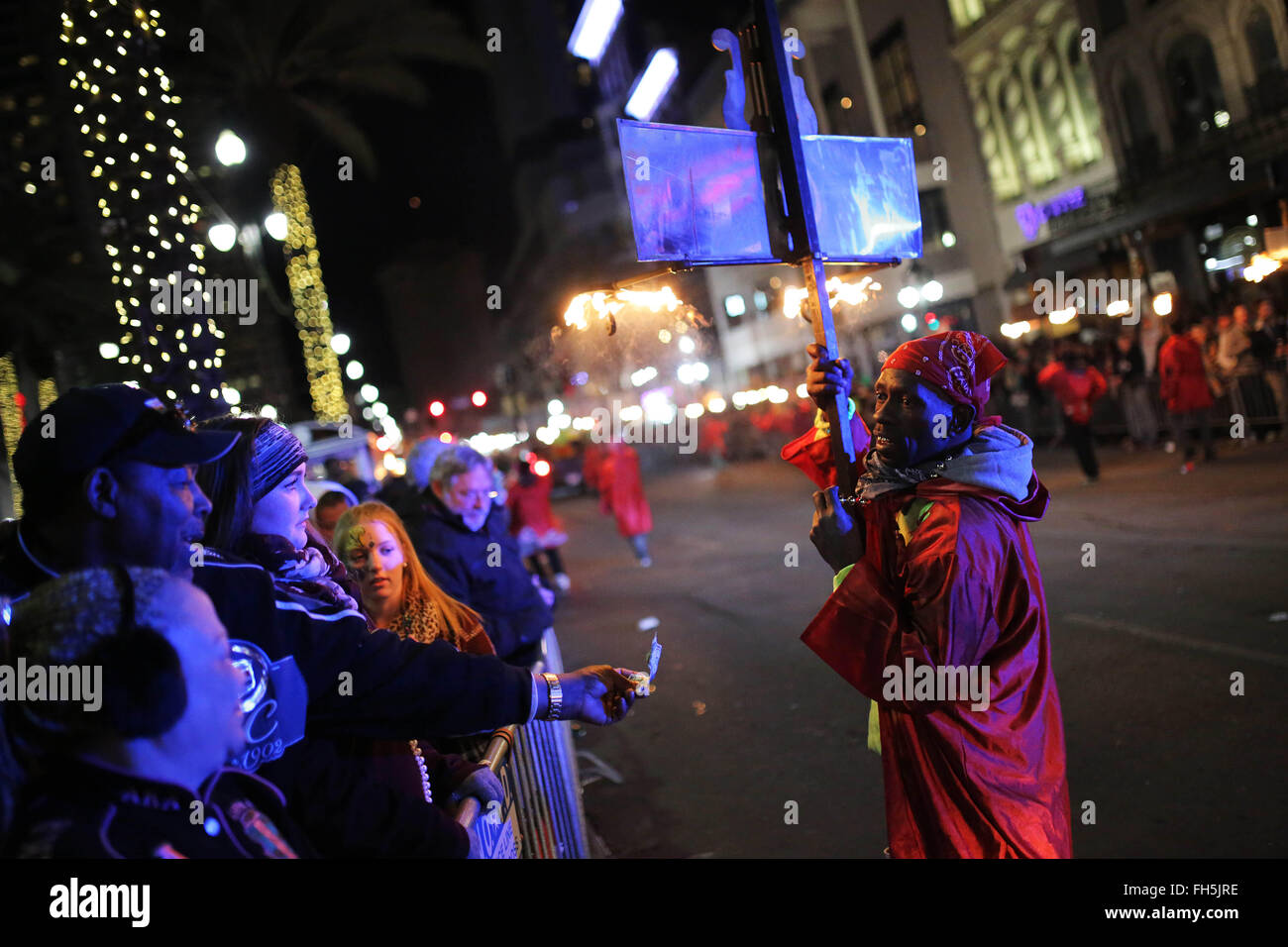 New Orleans, LOUISIANA, USA. 8th Feb, 2016. A member of the crowd hands ...