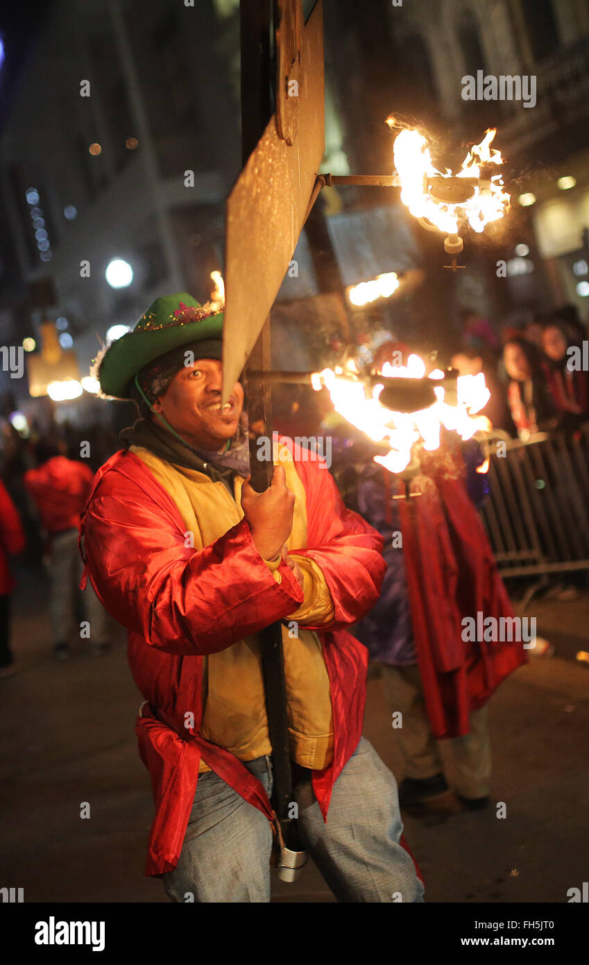 New Orleans, LOUISIANA, USA. 8th Feb, 2016. A flambeaux marches during ...