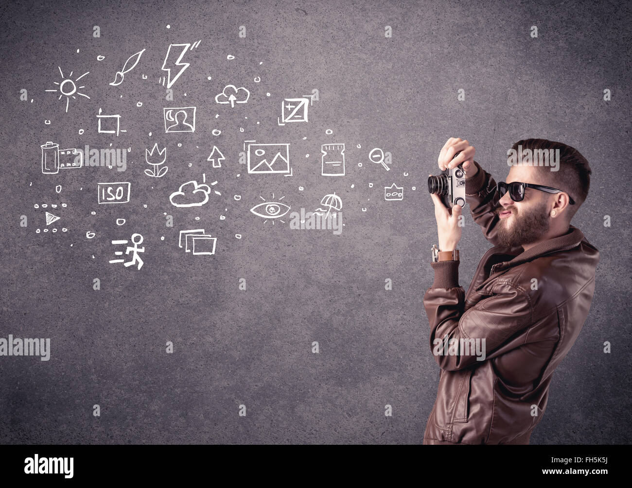 Elegant guy with beard learning photography Stock Photo - Alamy