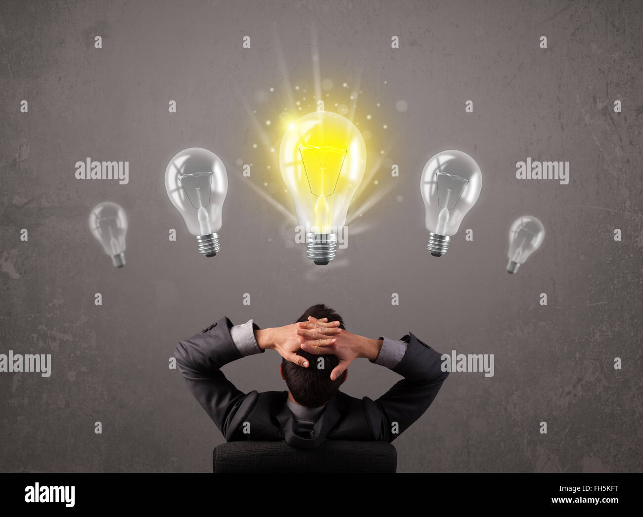 Business person having an idea light bulb concept Stock Photo - Alamy