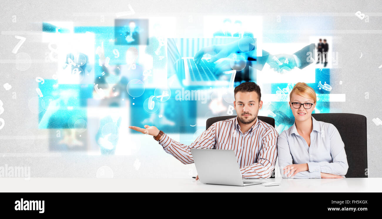 Business persons at desk with modern tech images at background Stock ...