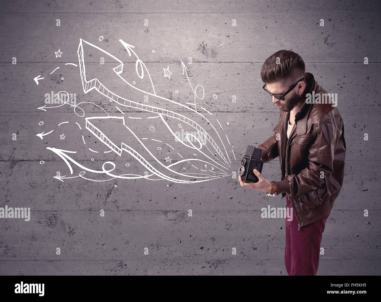 Funny guy taking photos with retro camera Stock Photo - Alamy