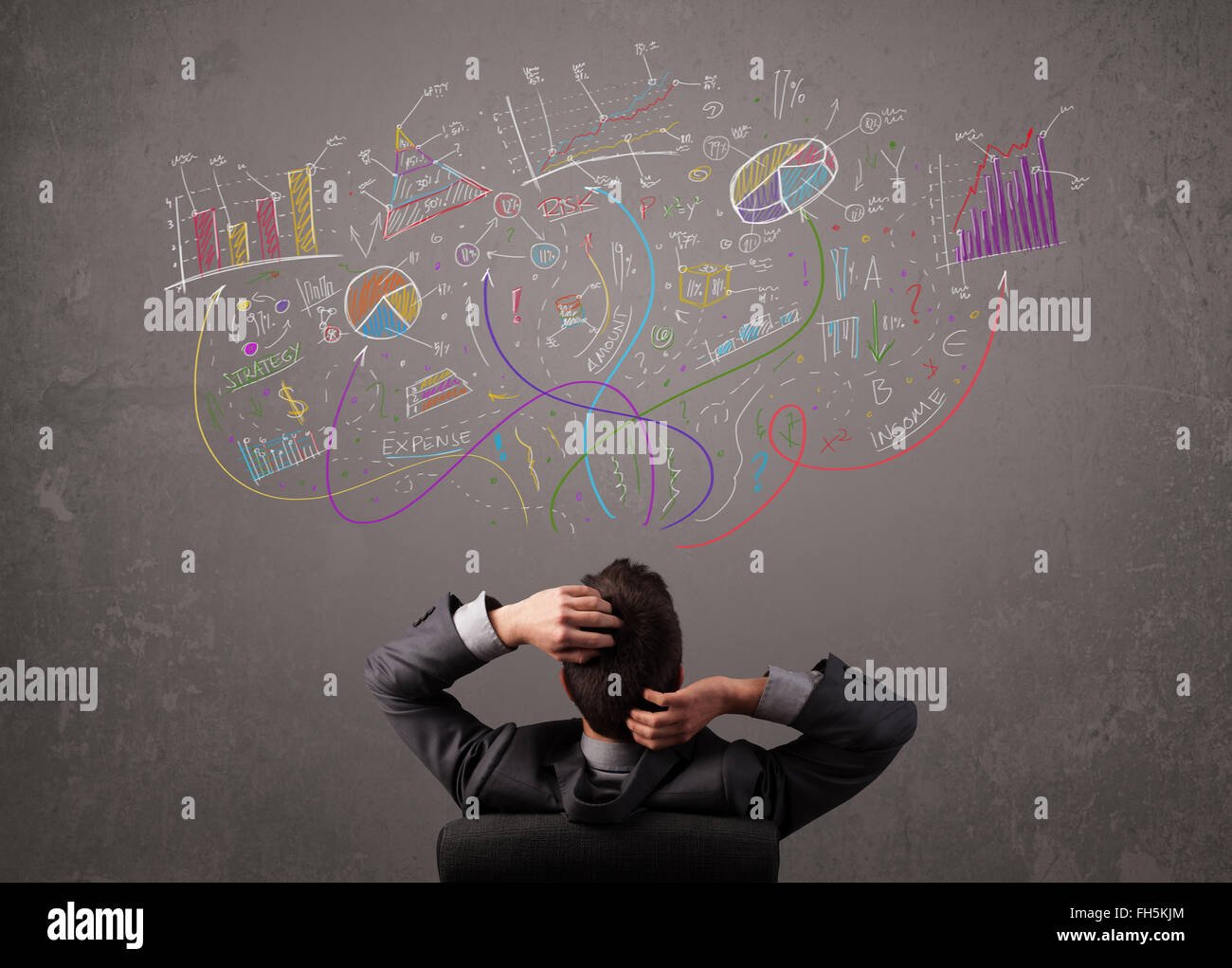 Young business man looking at sketches of graphs and symbols Stock ...