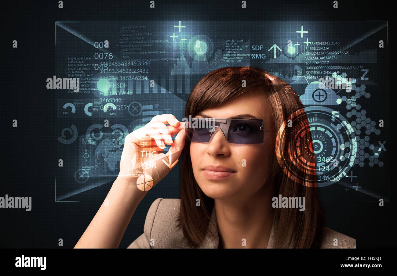 Young woman looking with futuristic smart high tech glasses Stock Photo ...