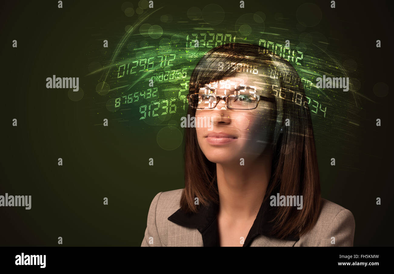 Business woman looking at high tech number calculations Stock Photo - Alamy