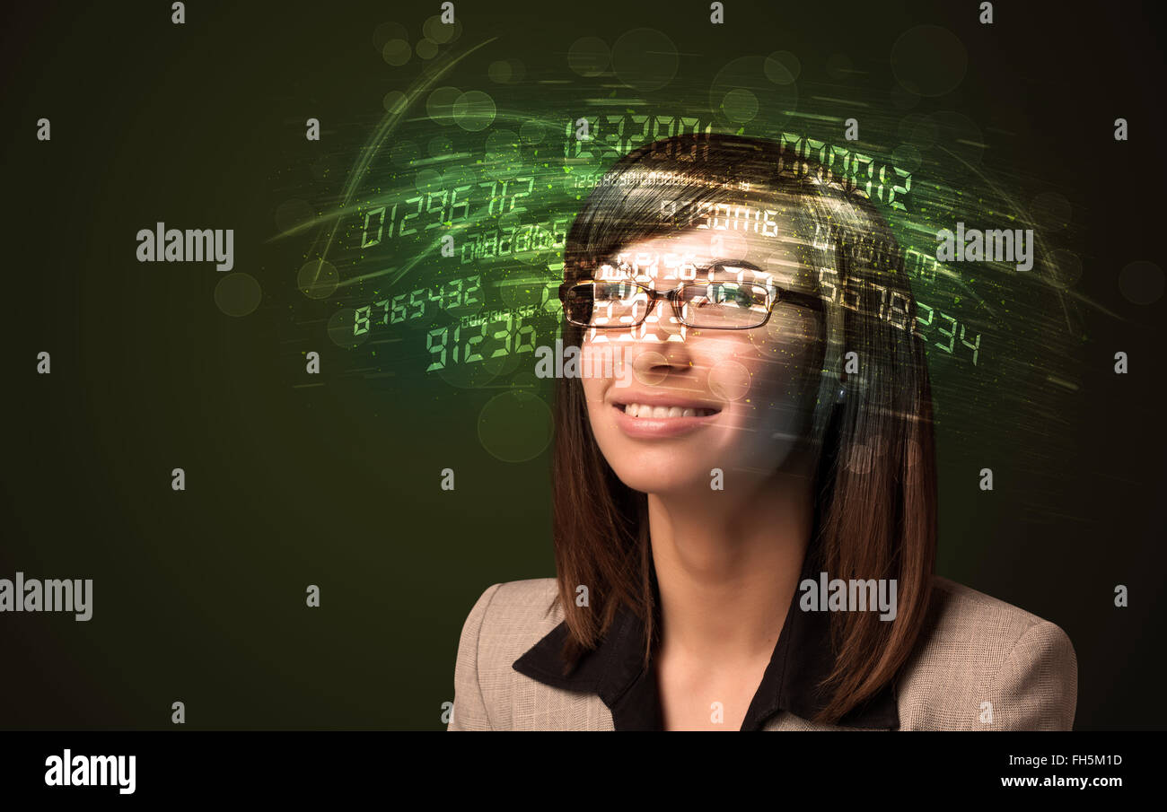 Business woman looking at high tech number calculations Stock Photo - Alamy