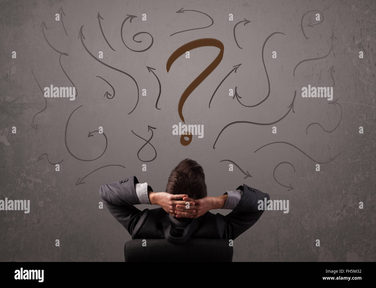 Business man looking at question mark sketch Stock Photo - Alamy
