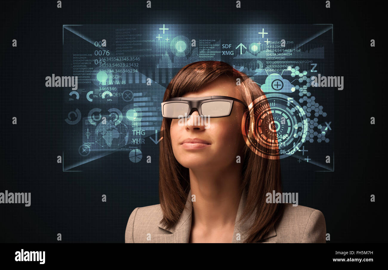 Young woman looking with futuristic smart high tech glasses Stock Photo ...