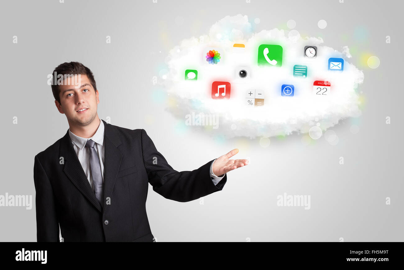 Young man presenting cloud with colorful app icons and symbols Stock ...