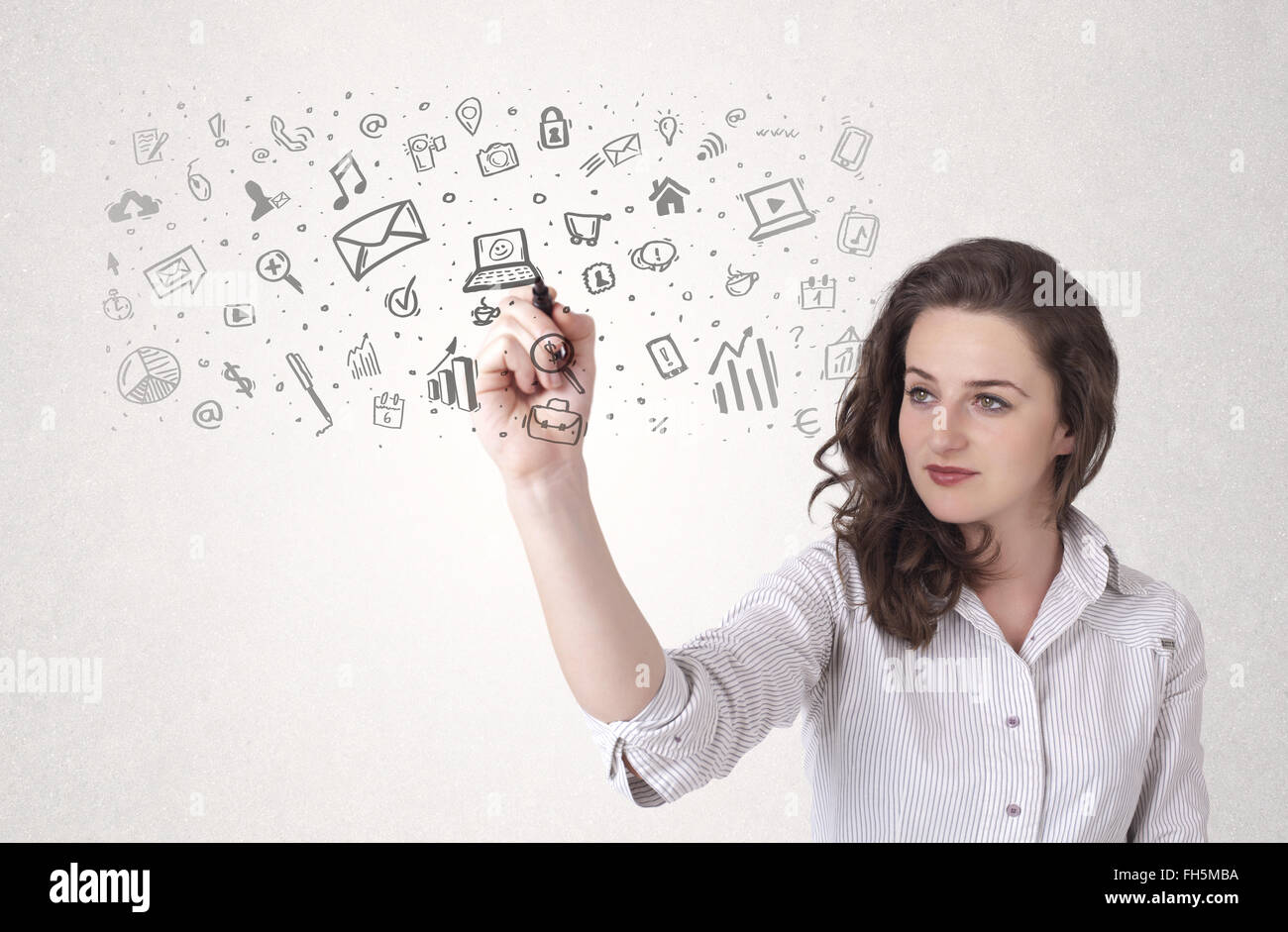 Young woman drawing and sketching icons and symbols Stock Photo - Alamy