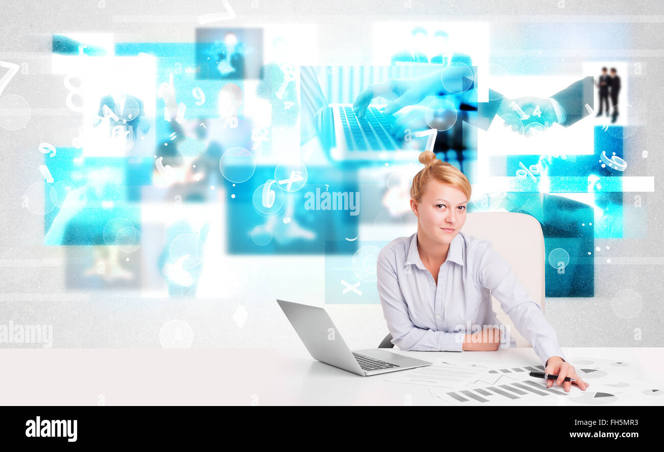 Business person at desk with modern tech images at background Stock ...