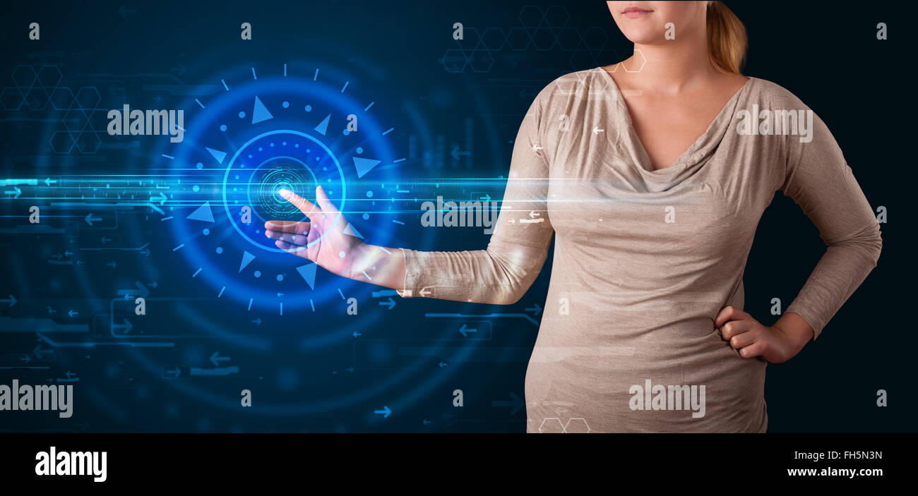 Young tech woman pressing high technology control panel screen concept ...
