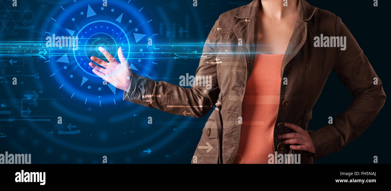 Young tech woman pressing high technology control panel screen concept ...