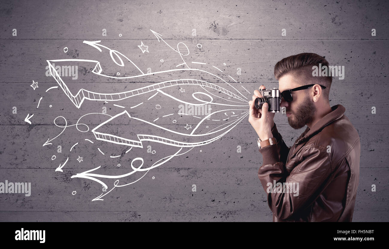 Funny guy taking photos with retro camera Stock Photo - Alamy