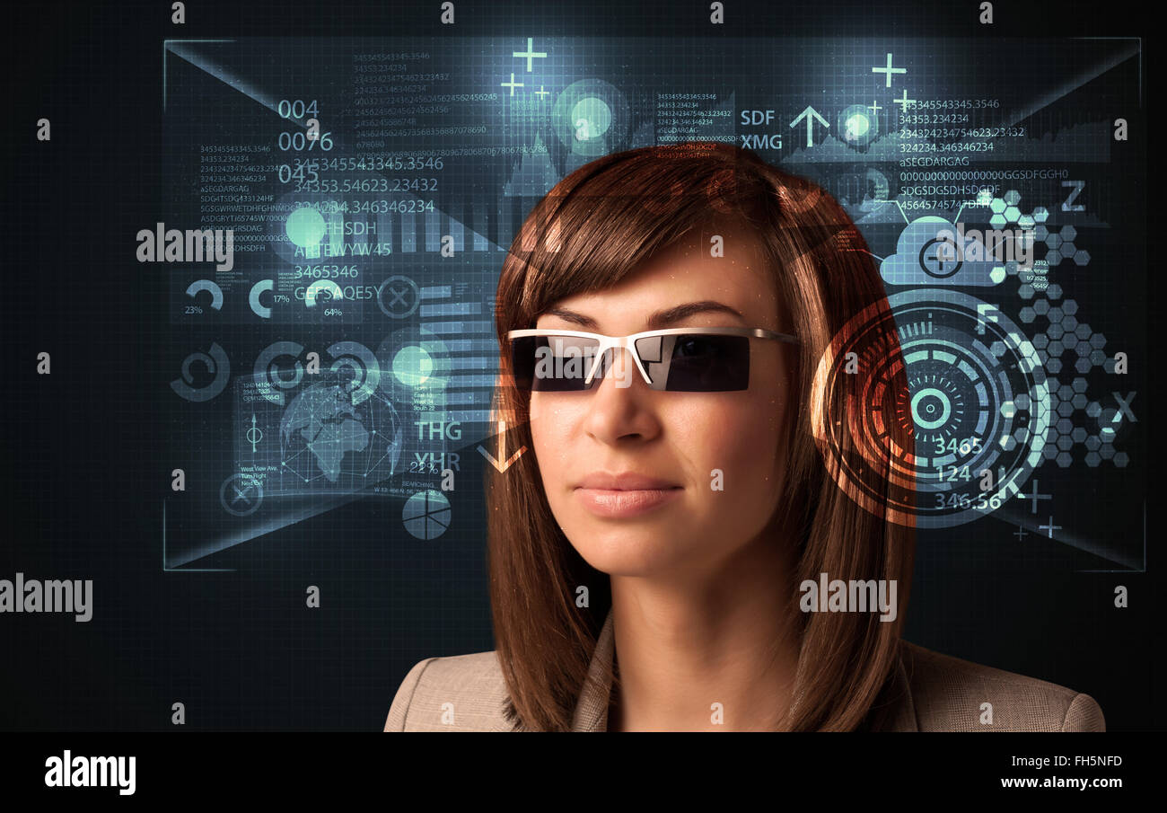 Young woman looking with futuristic smart high tech glasses Stock Photo ...