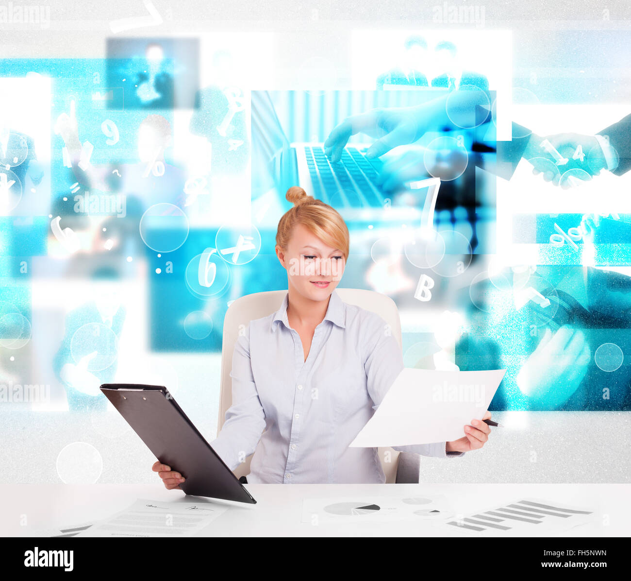 Business person at desk with modern tech images at background Stock ...