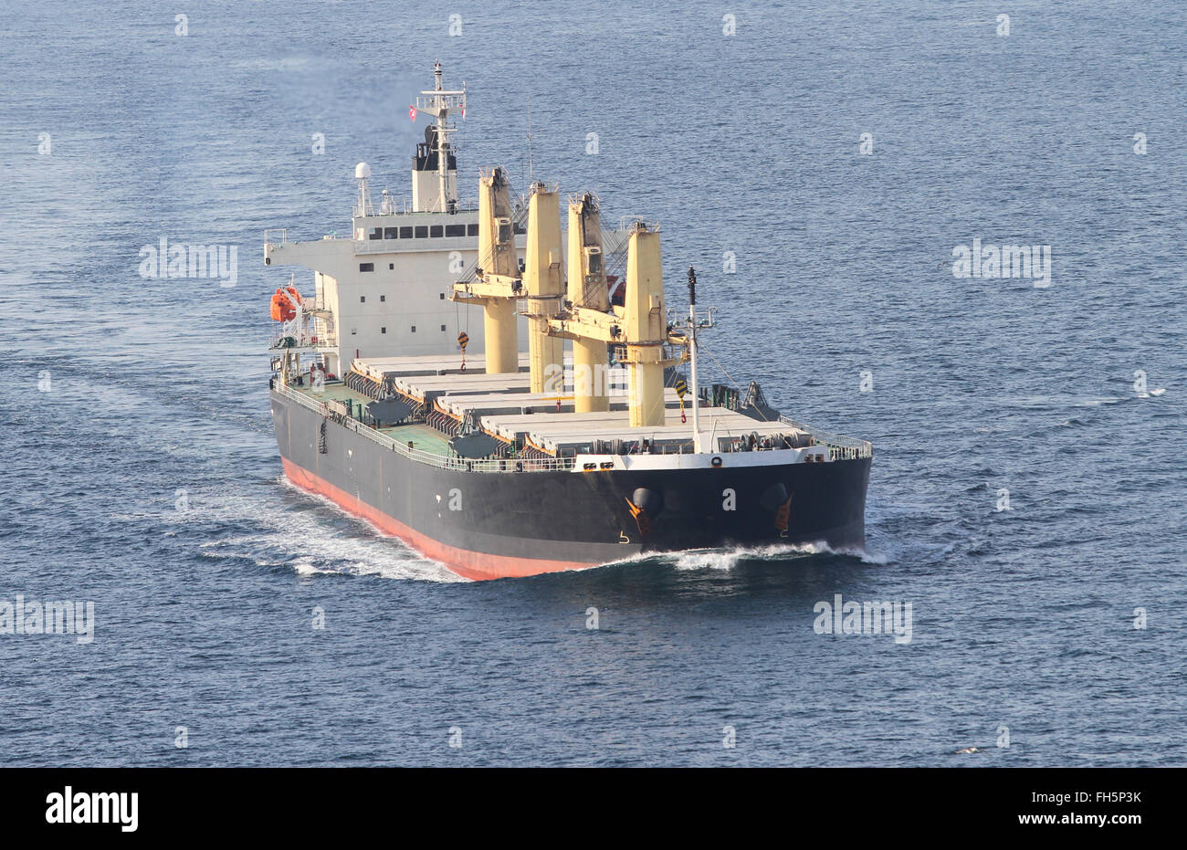 A cargo ship carrying goods between ports Stock Photo - Alamy