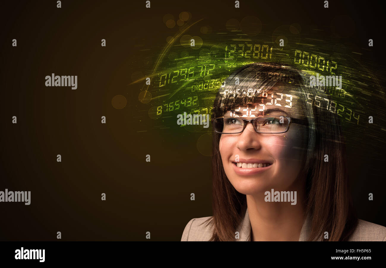 Business woman looking at high tech number calculations Stock Photo - Alamy