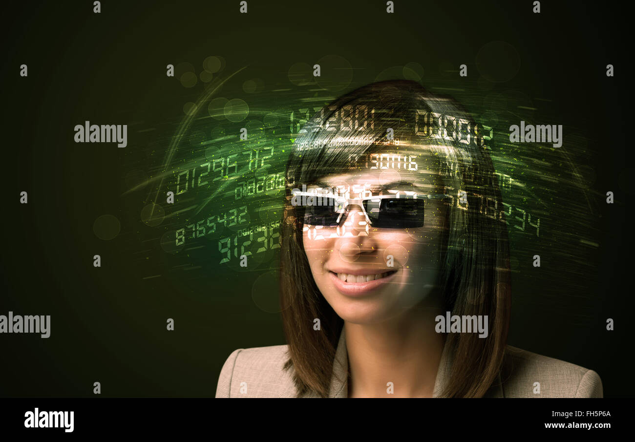 Business woman looking at high tech number calculations Stock Photo - Alamy