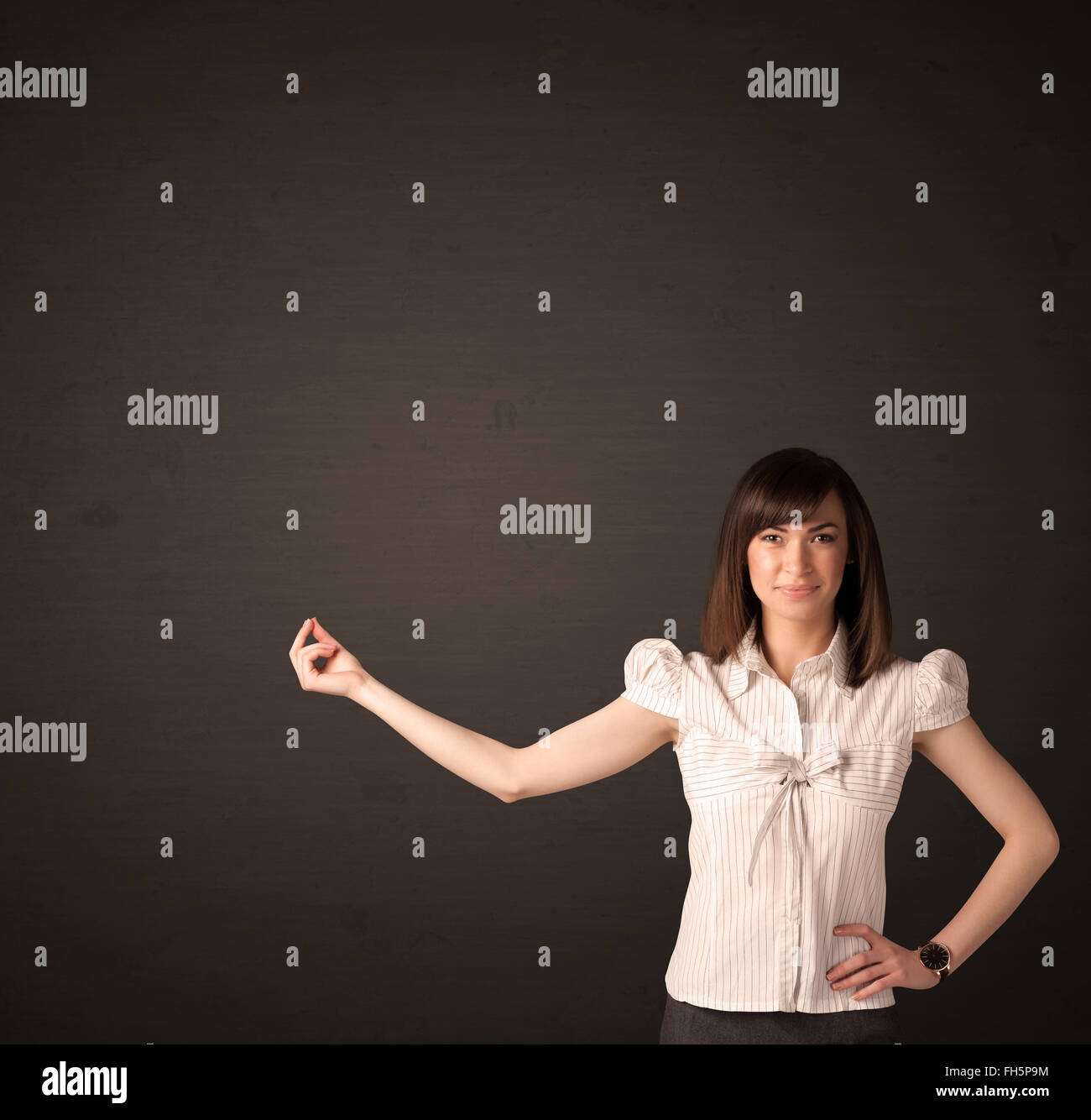 Businesswoman making gestures Stock Photo - Alamy