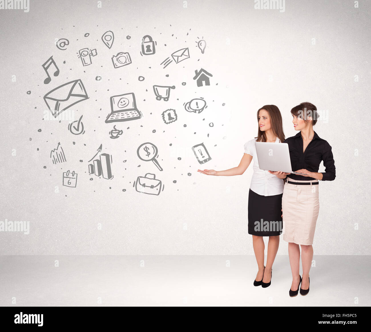 Young business woman presenting hand drawn media icons Stock Photo - Alamy