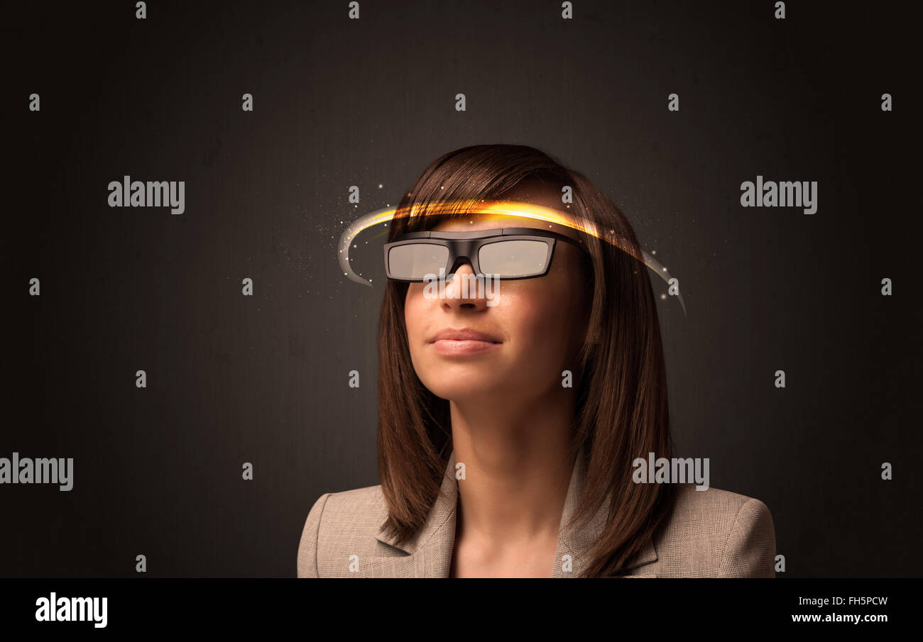 Pretty woman looking with futuristic high tech glasses Stock Photo - Alamy