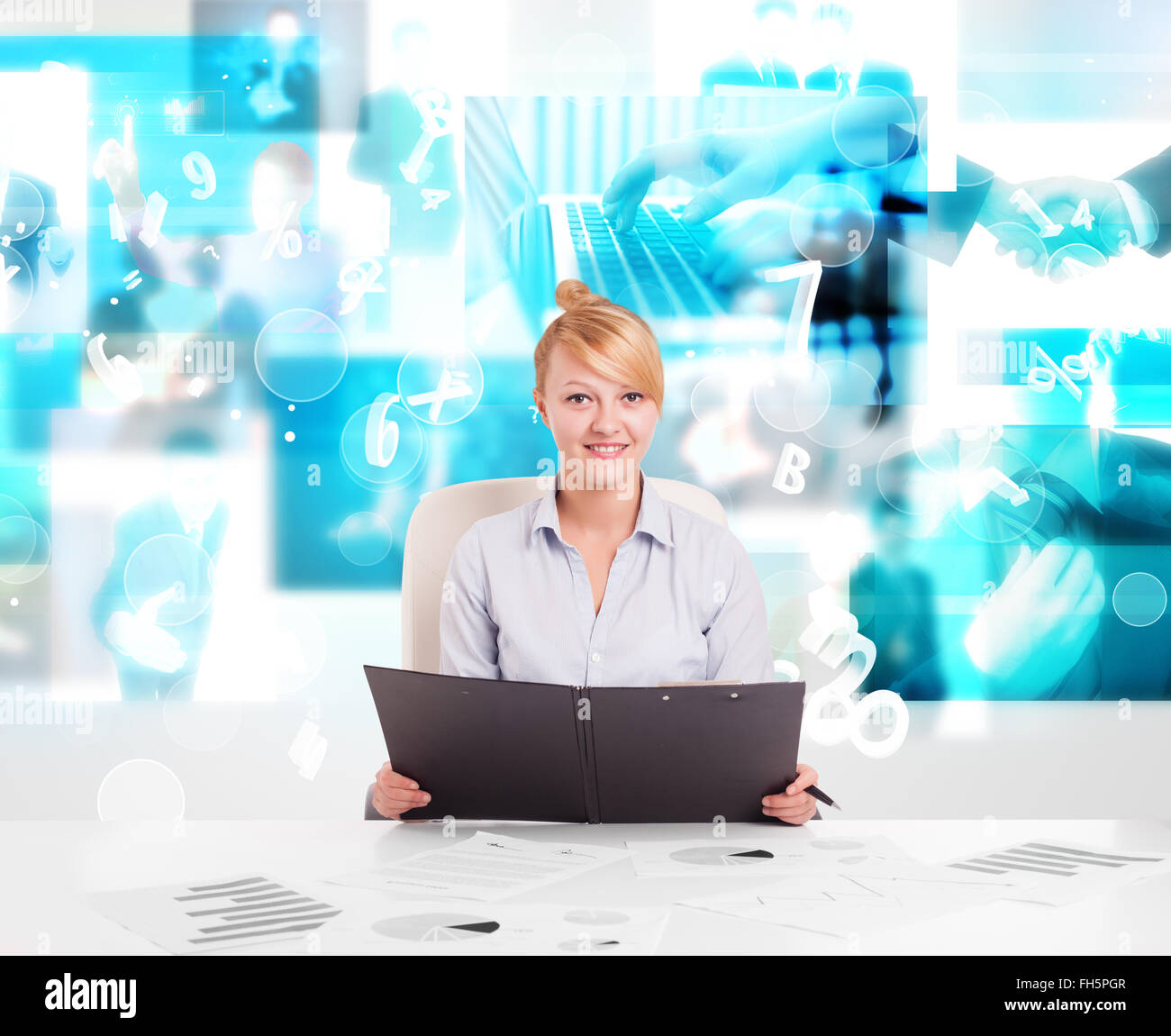 Business person at desk with modern tech images at background Stock ...