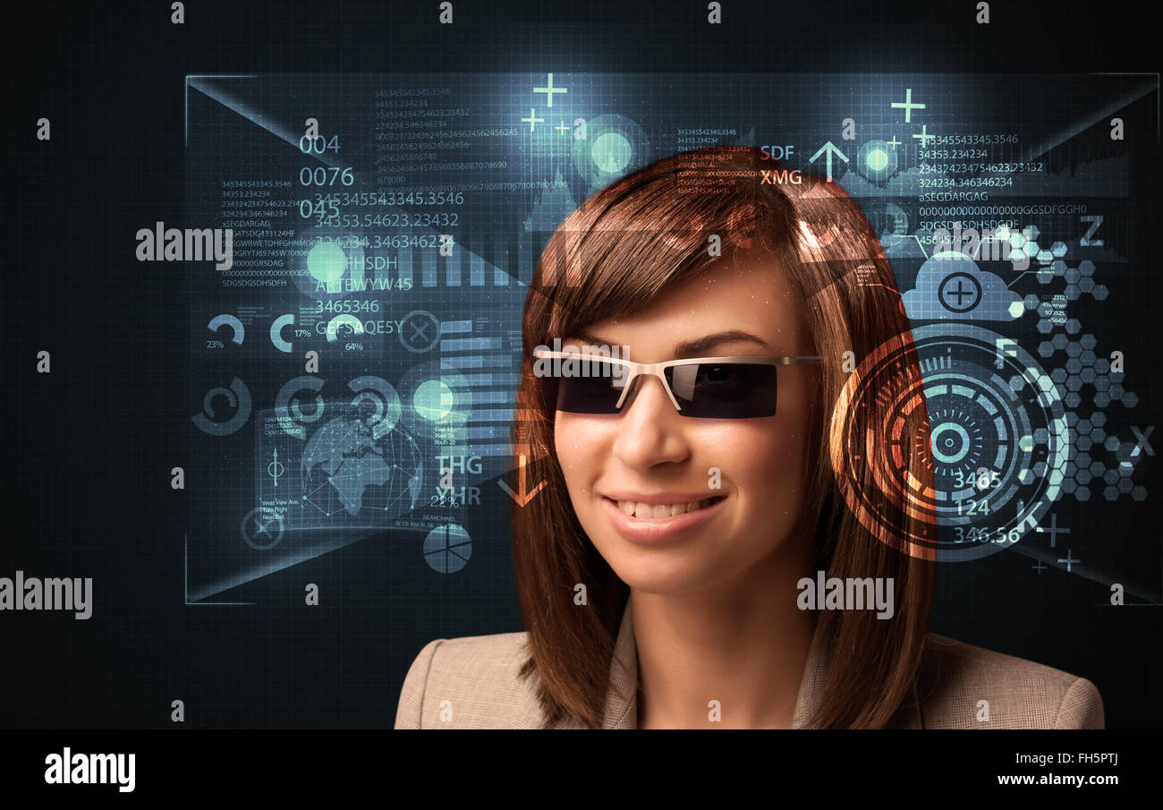Young woman looking with futuristic smart high tech glasses Stock Photo ...