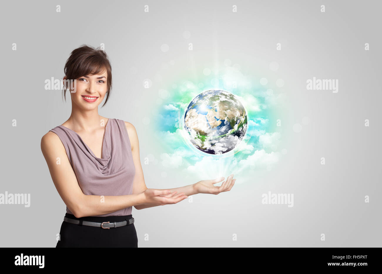 Young woman with earth and cloud concept Stock Photo - Alamy