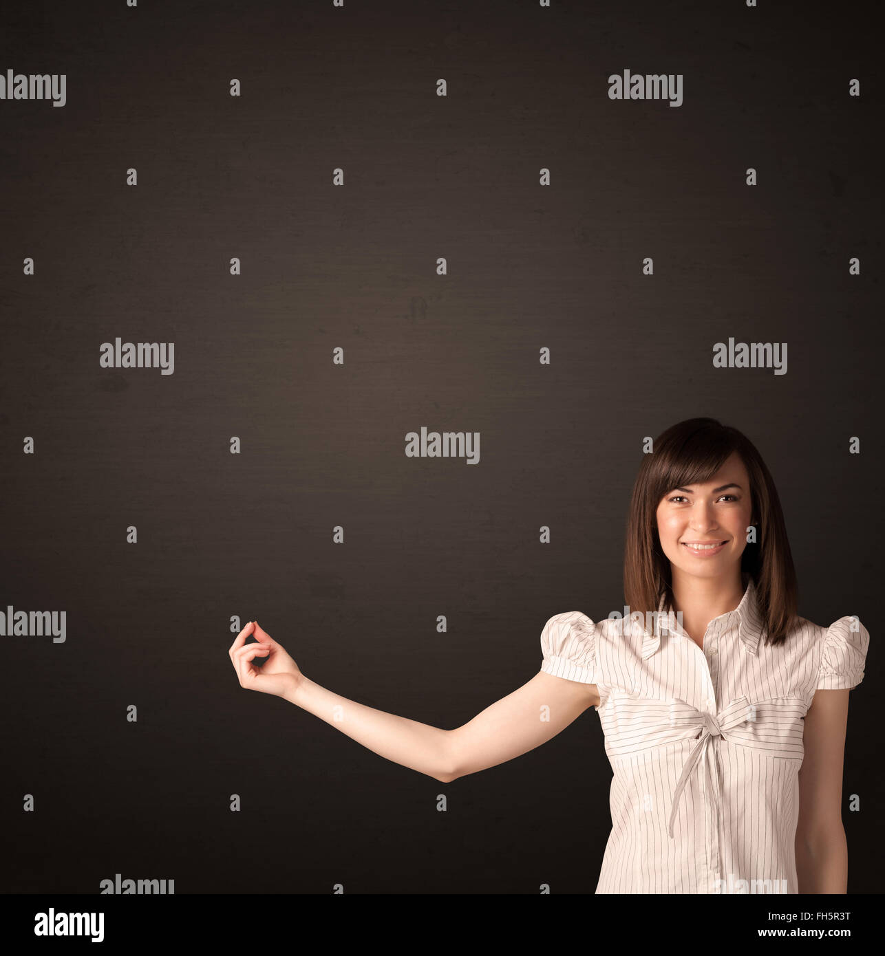 Businesswoman making gestures Stock Photo - Alamy