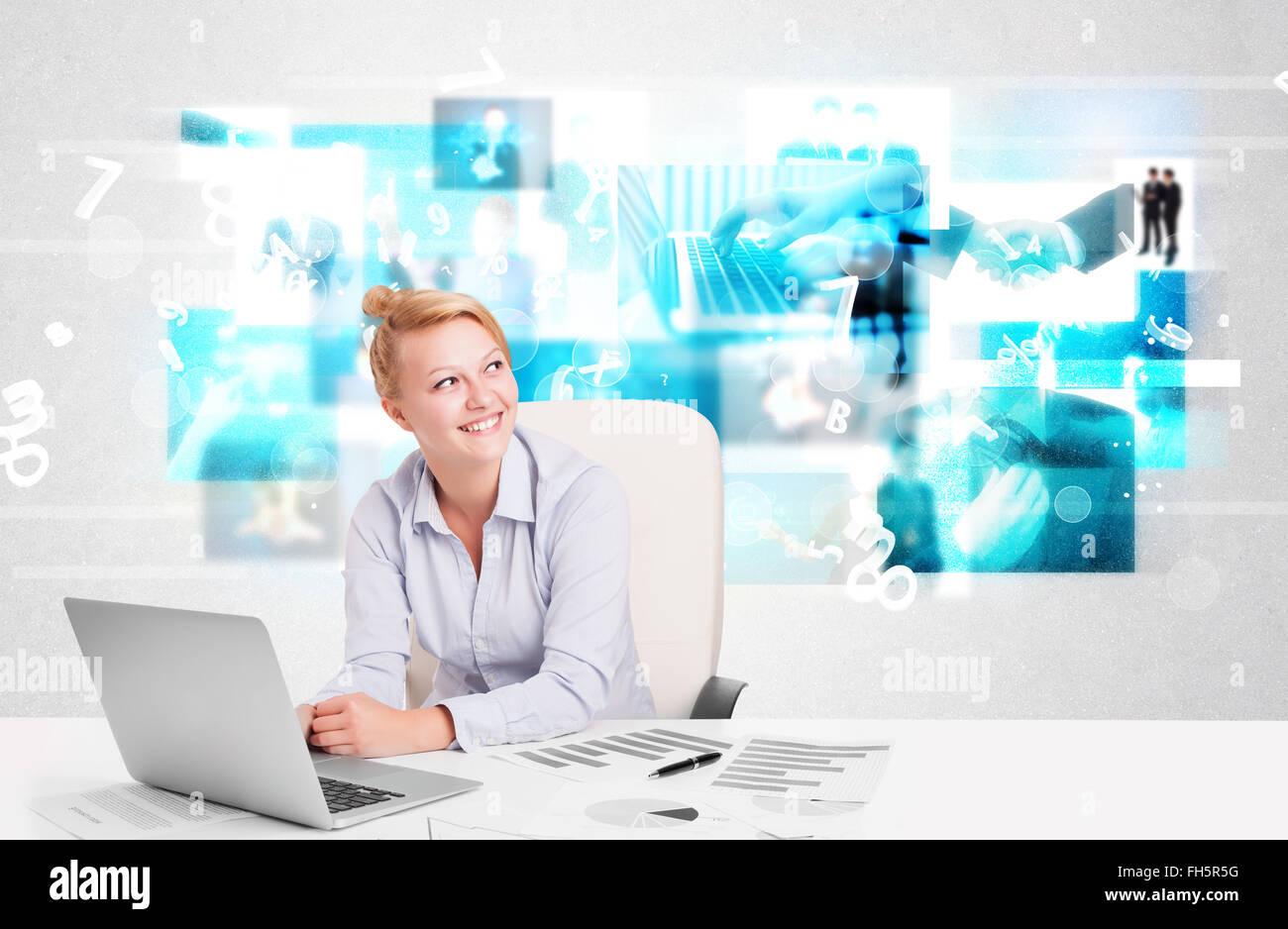 Business person at desk with modern tech images at background Stock ...