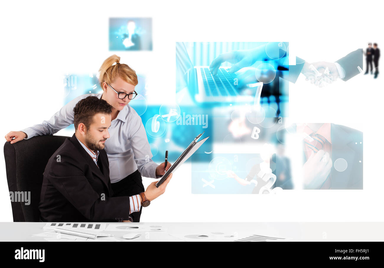 Business persons at desk with modern tech images at background Stock ...