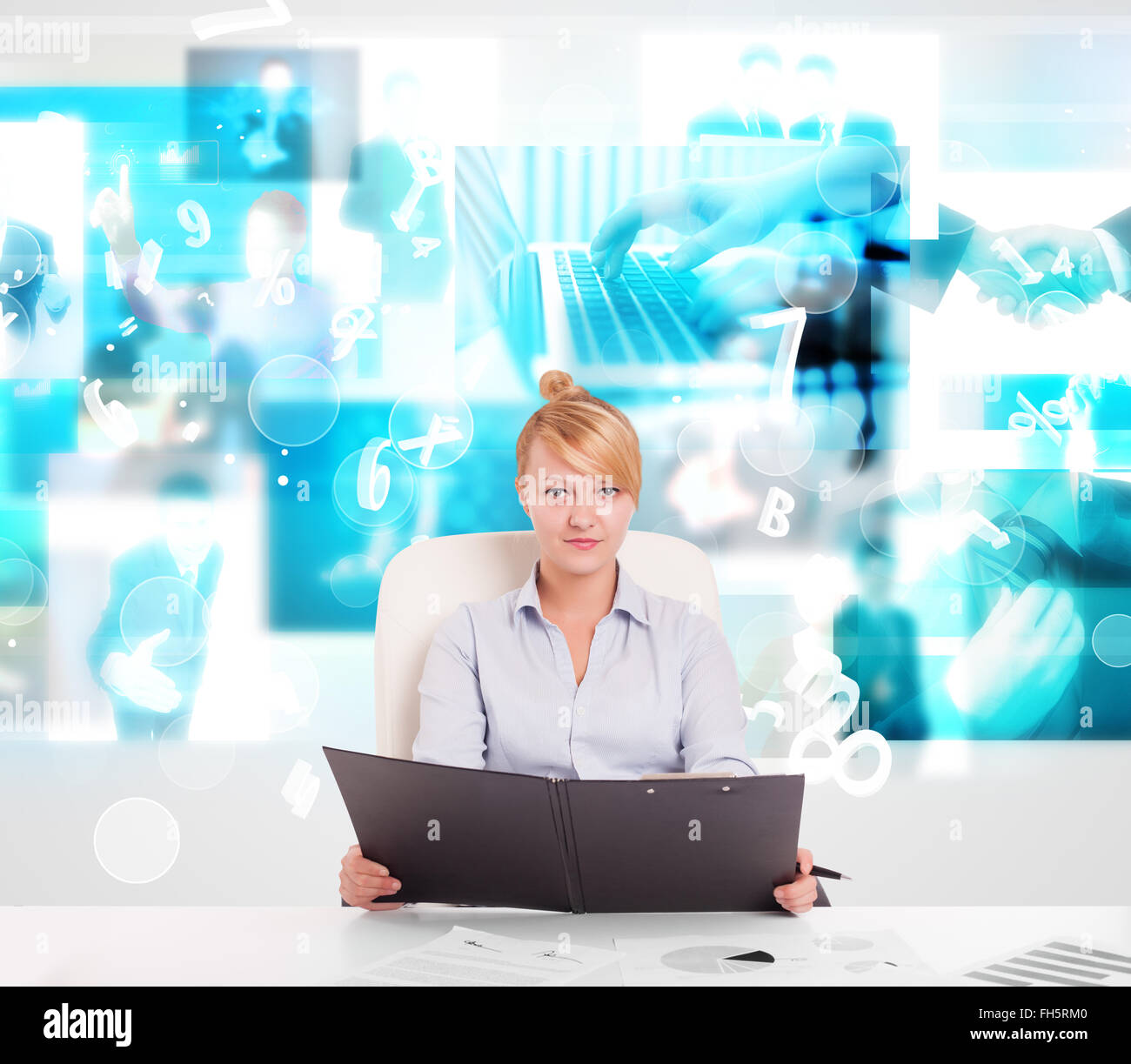 Business person at desk with modern tech images at background Stock ...