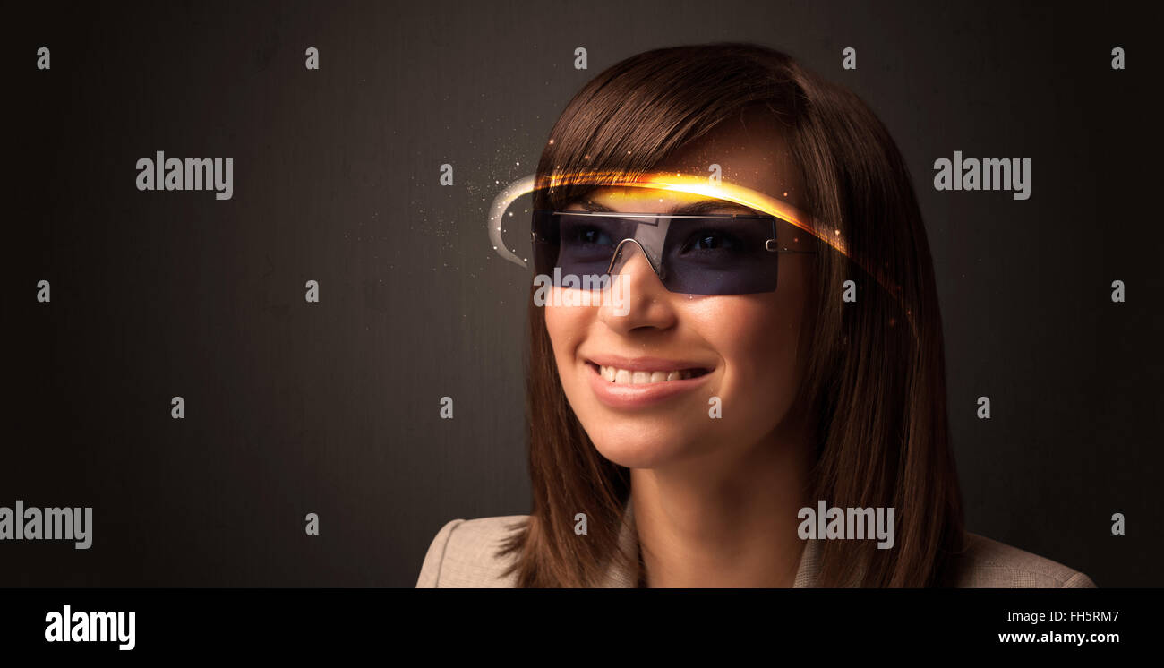 Pretty woman looking with futuristic high tech glasses Stock Photo - Alamy