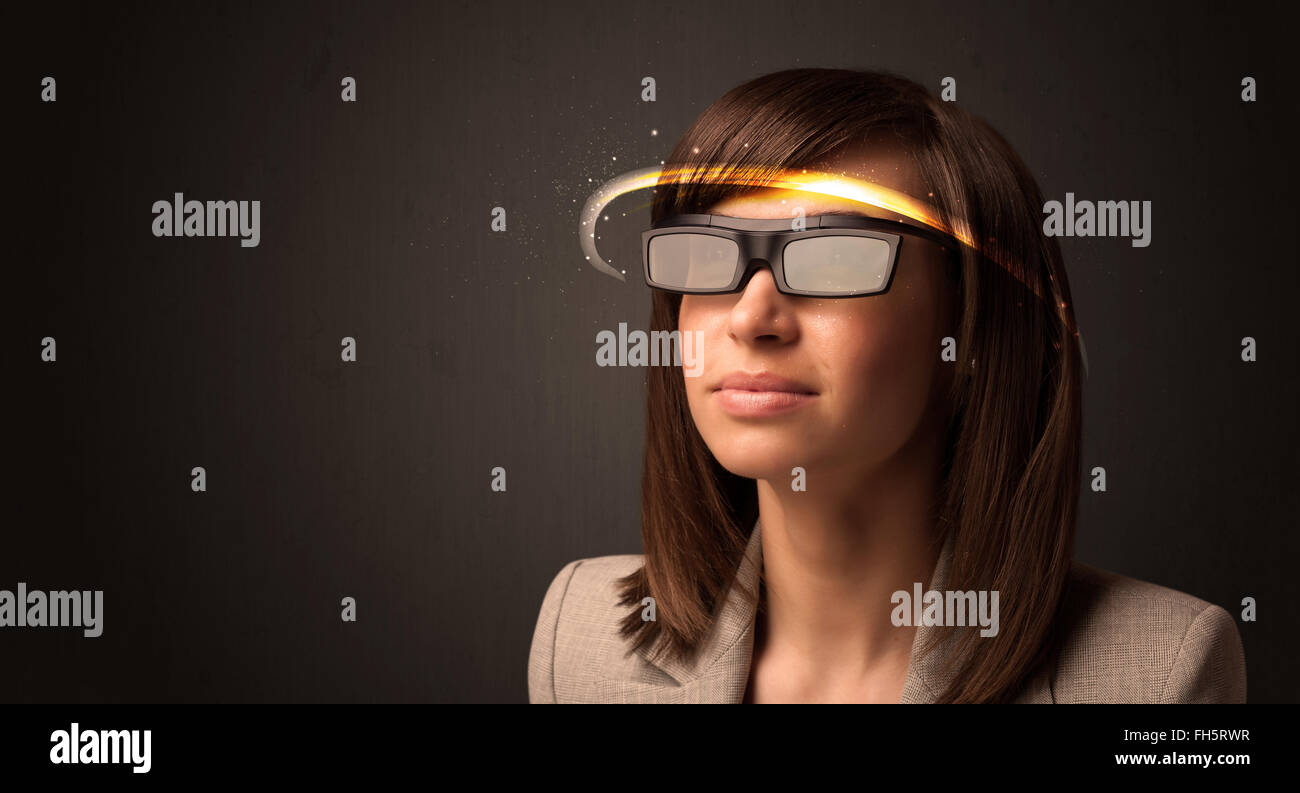 Pretty woman looking with futuristic high tech glasses Stock Photo - Alamy