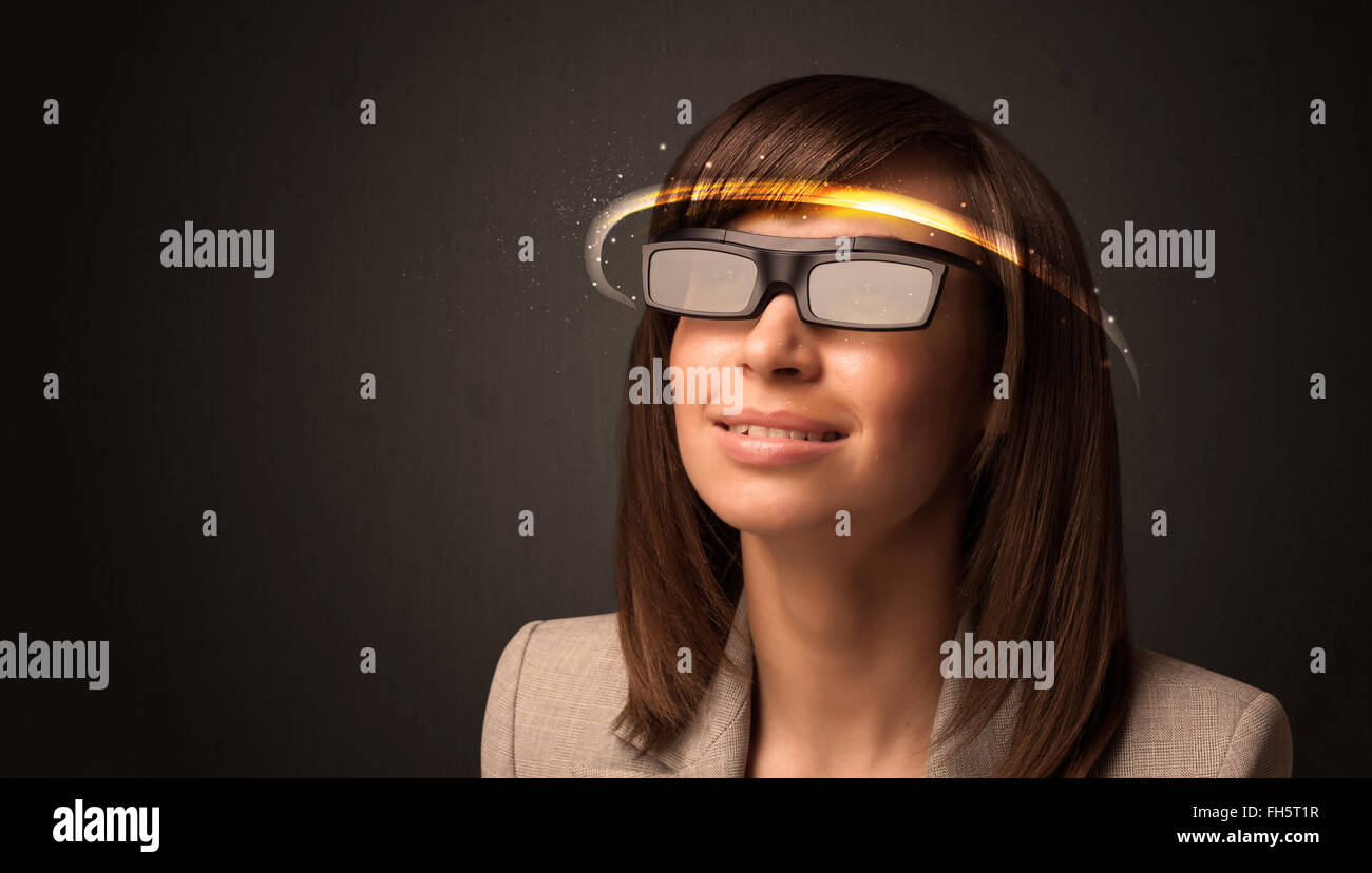 Pretty woman looking with futuristic high tech glasses Stock Photo - Alamy