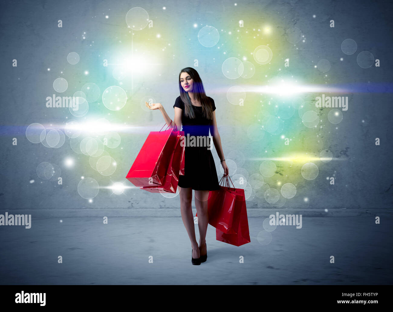 Mall lady with shopping bags and glitter light Stock Photo - Alamy