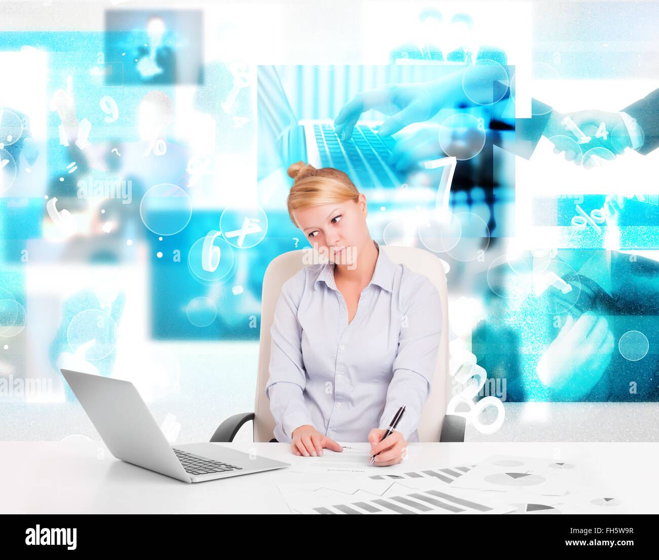 Business person at desk with modern tech images at background Stock ...