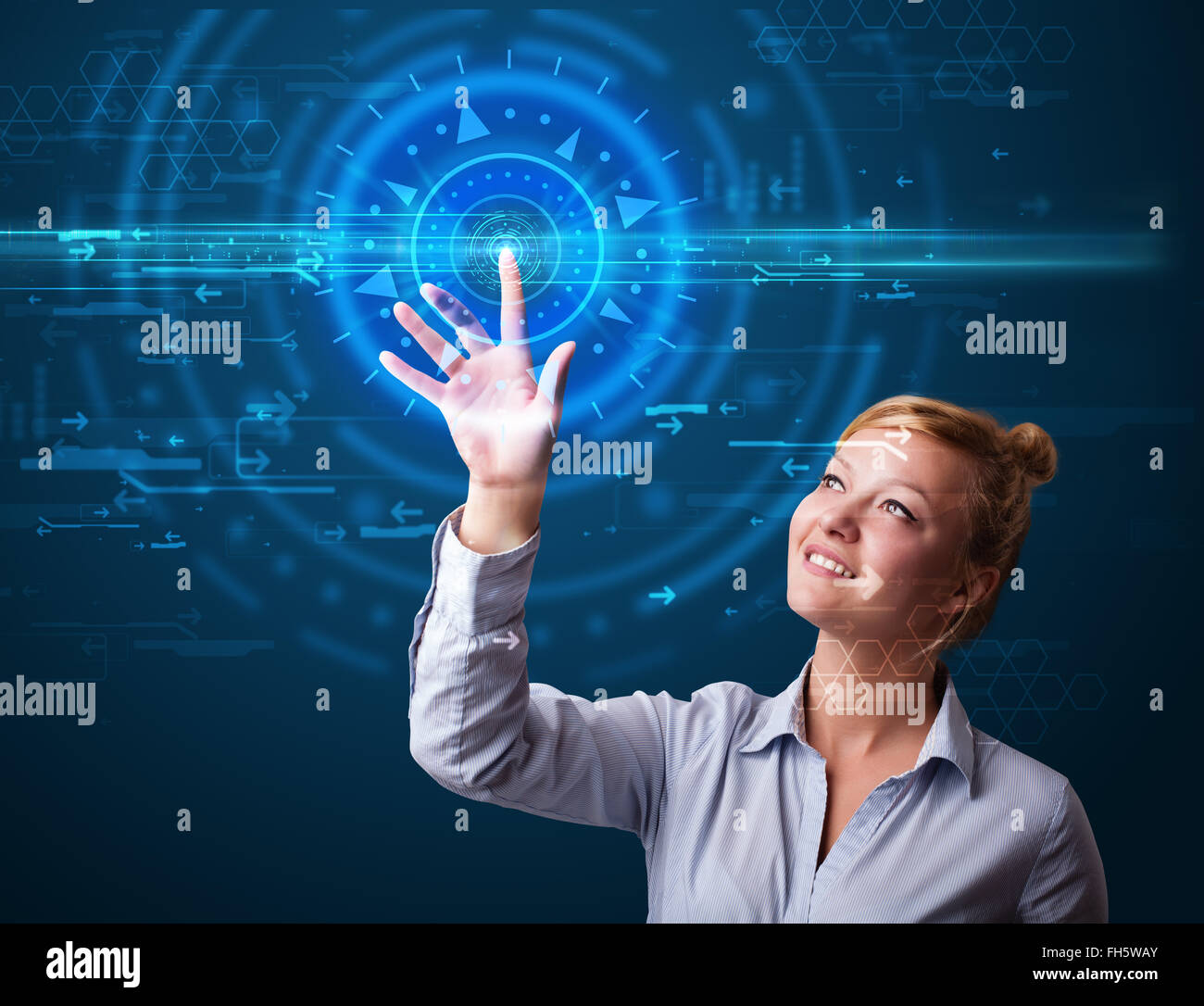 Young tech woman pressing high technology control panel screen concept ...