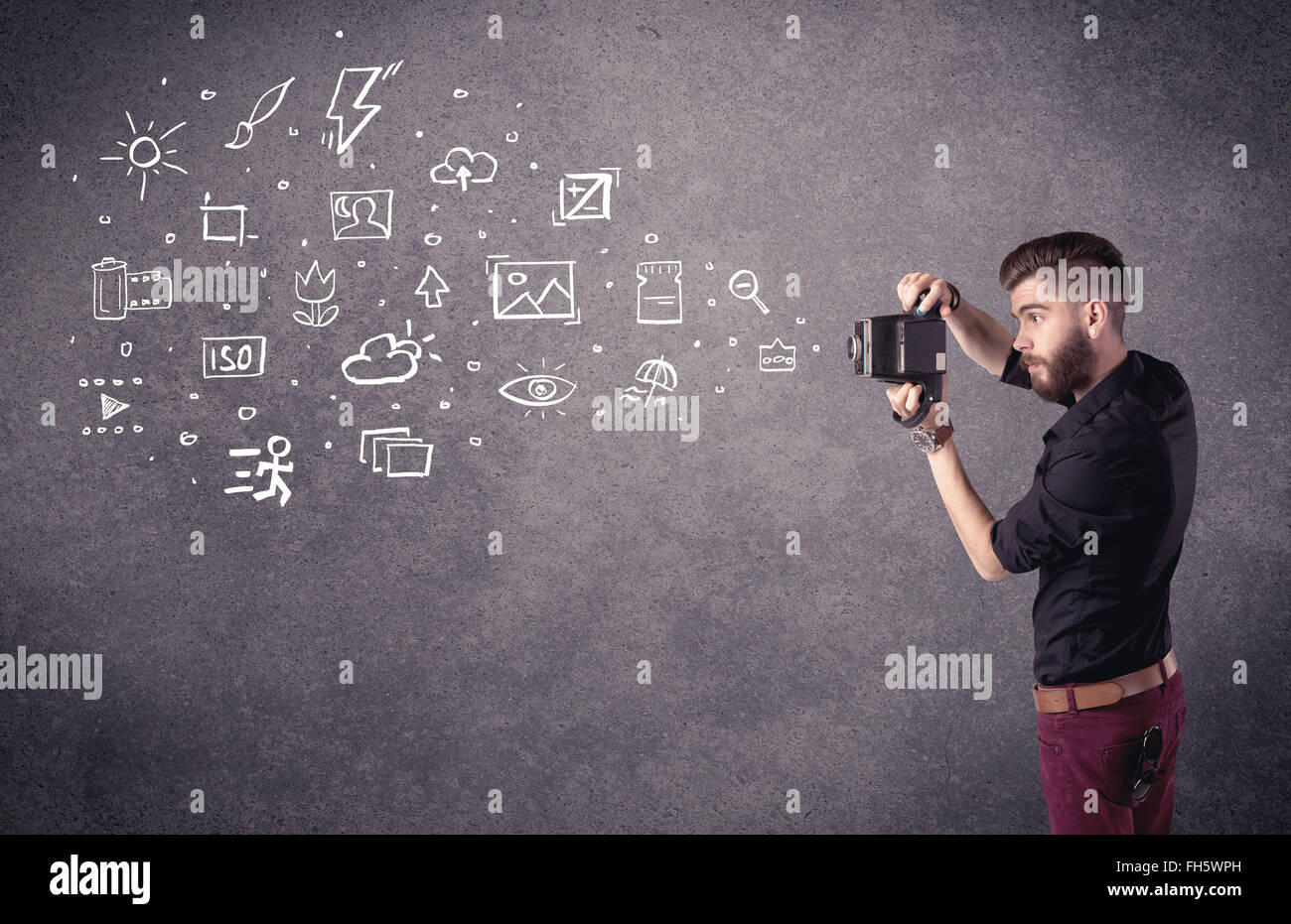 Elegant guy with beard learning photography Stock Photo - Alamy