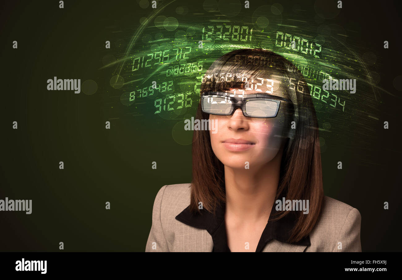 Business woman looking at high tech number calculations Stock Photo - Alamy