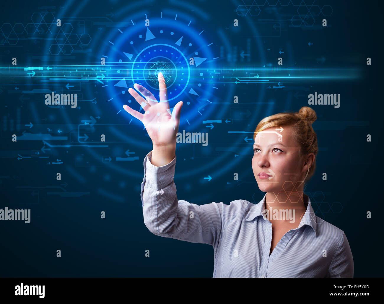 Young tech woman pressing high technology control panel screen concept ...