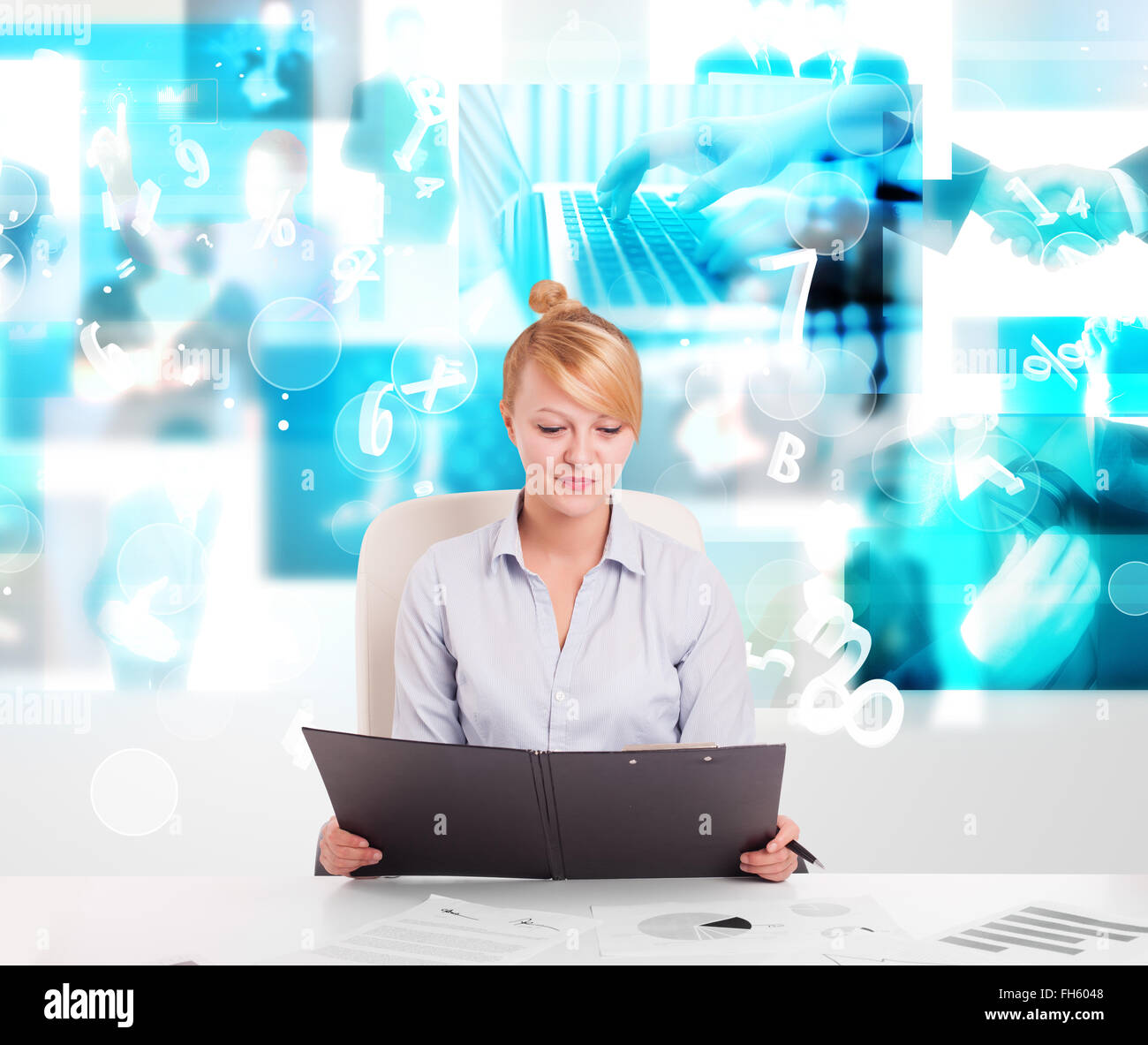 Business person at desk with modern tech images at background Stock ...